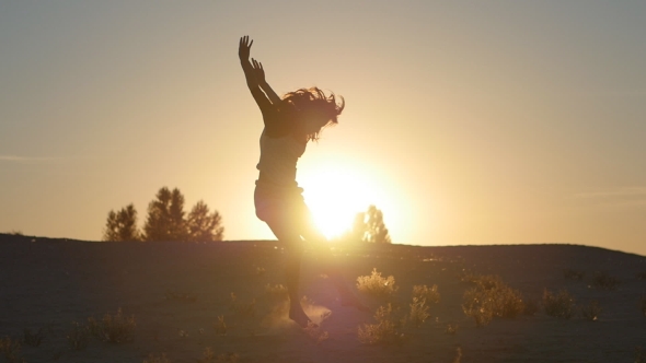 Silhouette Of a Girl a Professional Dancer Jumping At Sunset In The ...
