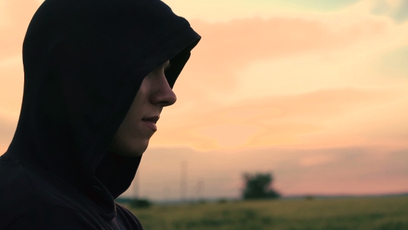 Profile Of Man In Hood On The Sunset Background. , Stock Footage ...