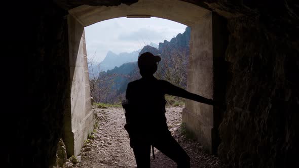 Girl Flexes Muscles and Does Training in a Cave in the Mountains, Stock ...