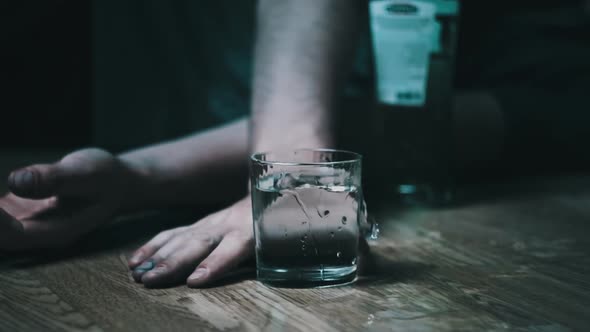Drunken Man Falls to the Floor with Glass of Vodka Alcohol Overdose ...