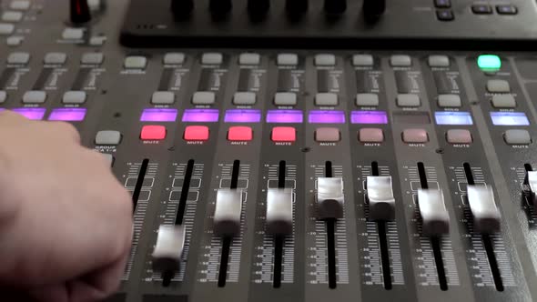 Remote control for adjusting the sound. Audio mixer. Sound engineer ...