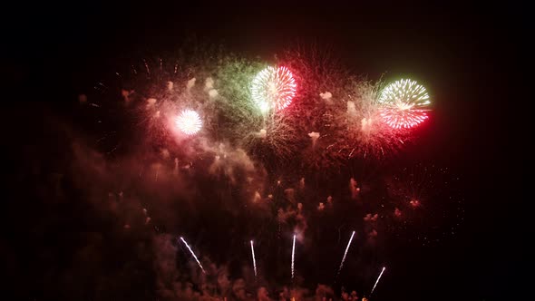 Colorful real fireworks display celebration in New year's eve with an ...