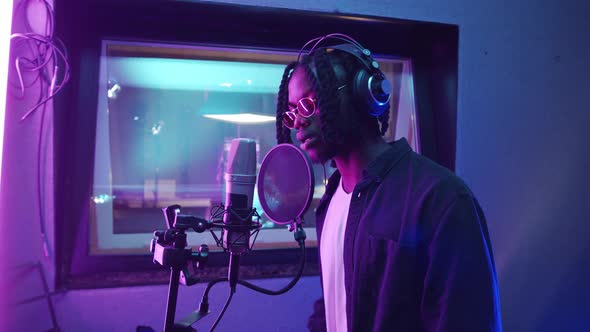 African American Rapper Singing in Mic in Recording Studio, Stock Footage