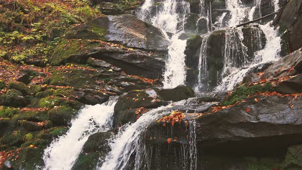 Waterfall Falling Down Mountain Slope in Autumn Forest, Stock Footage