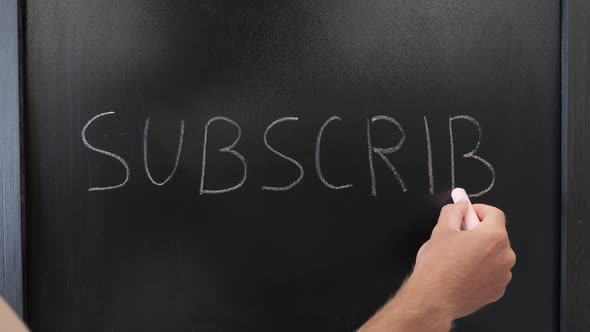 Word "Subscribe" written on black chalkboard, Stock Footage | VideoHive