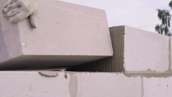 bricklayer, the builder lays bricks or blocks using a stretched rope ...