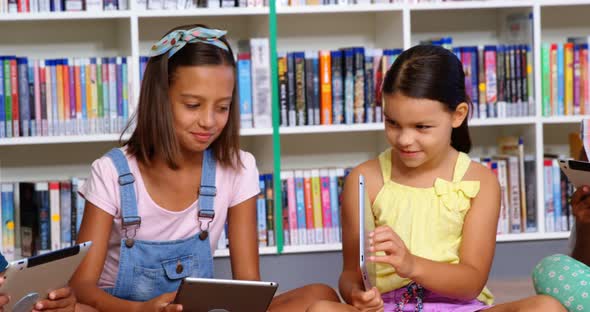 School kids using digital tablet in library, Stock Footage | VideoHive