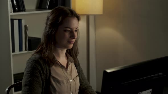 Female office worker types and celebrates finishing a big job., Stock ...