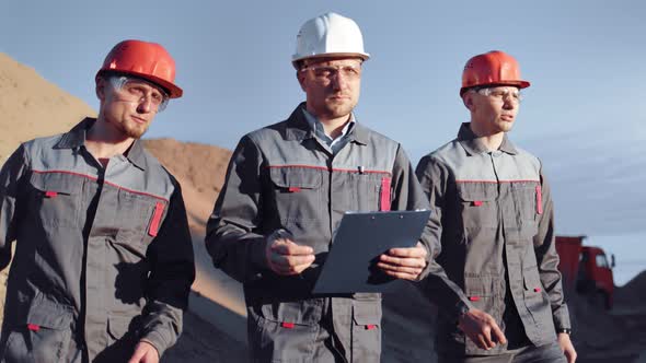 Focused Skilled Group of Industrial Male Worker Walking on Construction ...