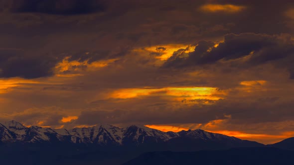 Cinemagraph panorama of a fire-like sunset and clouds forming in a ...
