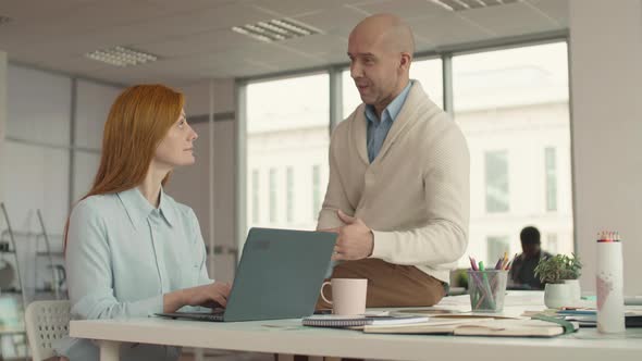 Man Distracting Colleague From Work, Stock Footage | VideoHive