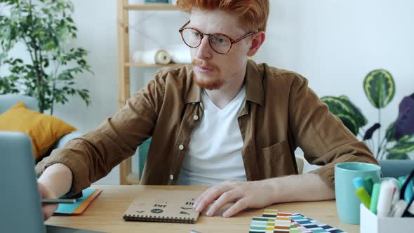 Portrait of Freelance Logo Designer Drawing Symbols on Paper and Using ...