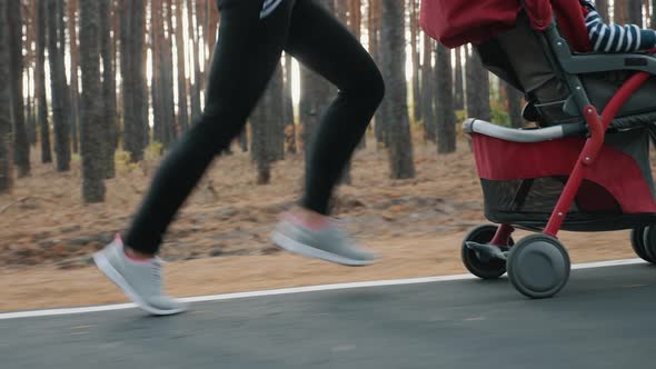 Woman Running with a Baby Stroller, Stock Footage | VideoHive
