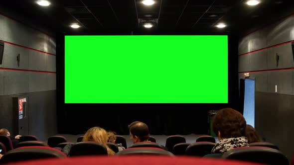 Audience Looking at Green Screen in Cinema Hall, Spectators Watching ...