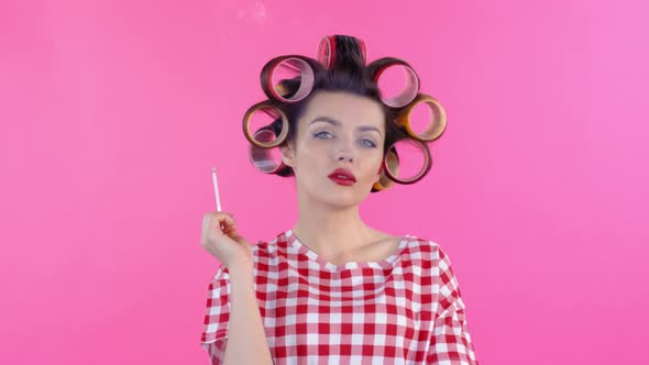 Woman in Hair Rollers Smoking Cigarette, Stock Footage | VideoHive