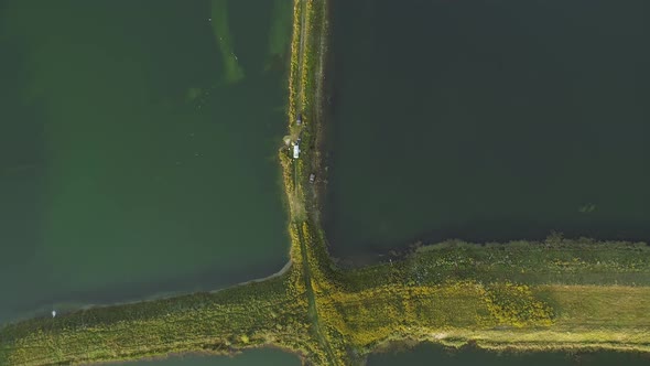 Isthmus over lake in Poland. Aerial top-down backward, Stock Footage