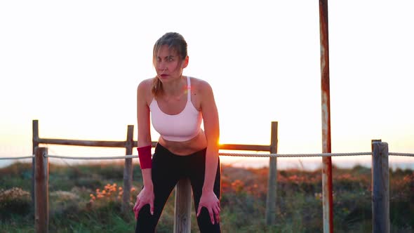 Woman Runner Lean Knee While Taking Rest Break on Beautiful Sunset ...