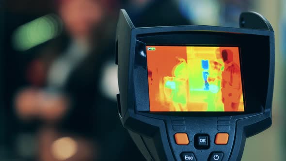 Screen of a Thermographic Camera Showing People's Thermal Image, Stock ...