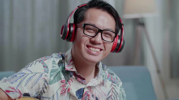 Man Composer With Notebook On Table Wearing Headphones And Smiling To ...