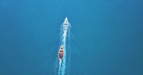 Aerial Top View of Two Sailing Boats Passing trough the Sea, Stock Footage