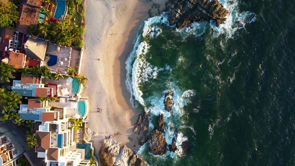 top down view of beautiful white sand rocky beach at Playa Amapas in ...