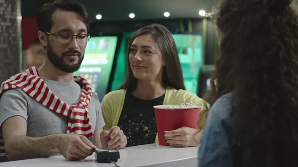 Couple Paying for Movie Tickets, Stock Footage | VideoHive