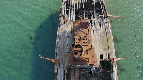 A Wrecked Wooden Ship Lies on the Seashore Covered with Rust, Stock Footage