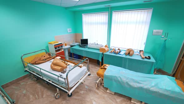 Medical dummies in university room. Practice and training room for ...