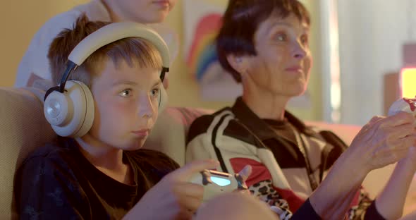 Boy Playing Video Game Using Controller Demonstrates Emotions ...
