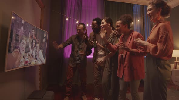 Two Groups of Friends Having Virtual House Party Together, Stock Footage