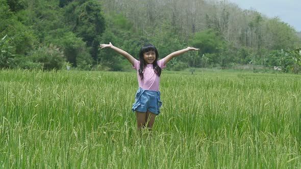 Little Girl Happy In Rice Field, Stock Footage | VideoHive