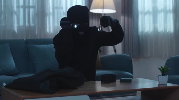 Thief Man Holding Flashlight Stealing A Watch In Someone's House Before ...
