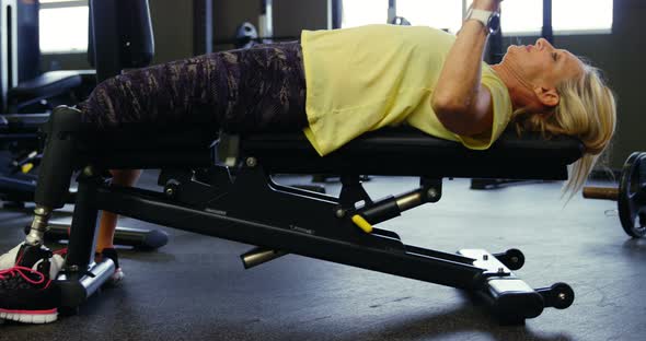 Senior woman doing chest press workout with dumbbell, Stock Footage
