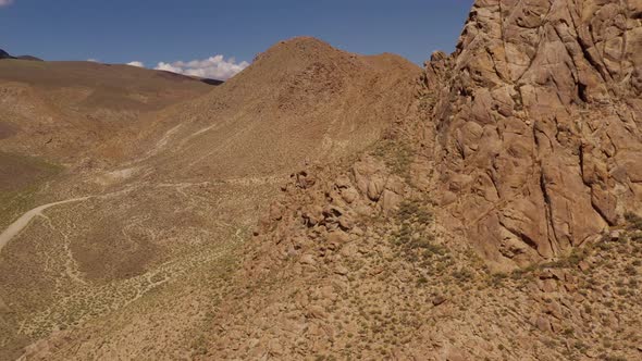 Aerial shot of interesting rock formations in the desert of California ...