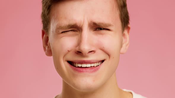 Frustrated Millennial Guy Crying Looking At Camera Over Pink Background ...