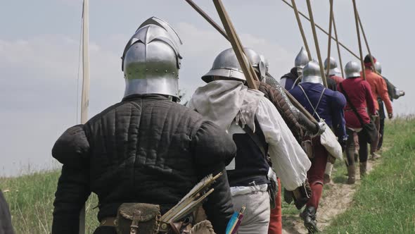 Back view of group medieval knights going on the battle. Military campaign of knights, Stock Footage