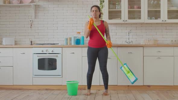 Cleaning Excited African Woman Dancing with Mop, Stock Footage | VideoHive