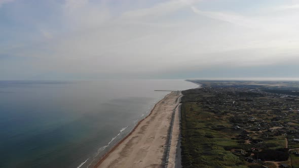 Aerial view of the North Sea shoreline with white bath houses at the ...