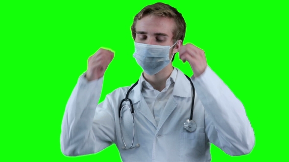 Smiling Doctor Removes Medical Mask Looking Into Screen., Stock Footage