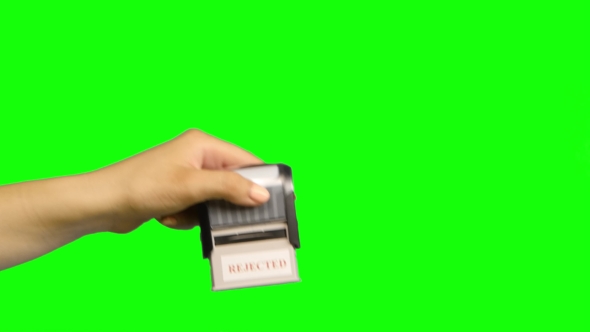 Girl Puts a Stamp On a Green Background. Green Screen, Stock Footage