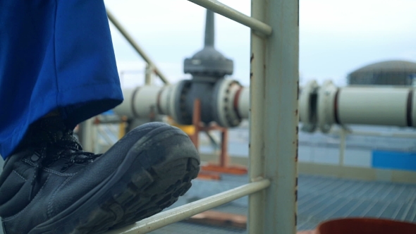 Engineer Feet Climbing The Tower Of a Large Oil Refinery. , Stock Footage