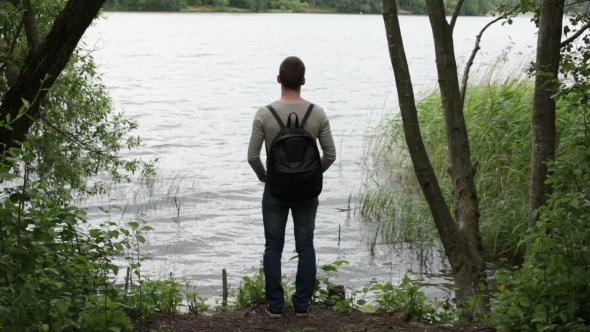 Sad Man Standing Along On a Bank Of a River, Stock Footage | VideoHive