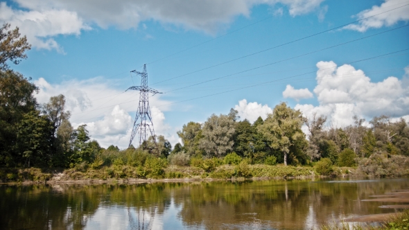 Electricity Power Lines and High Voltage Pylons on a Field in the ...
