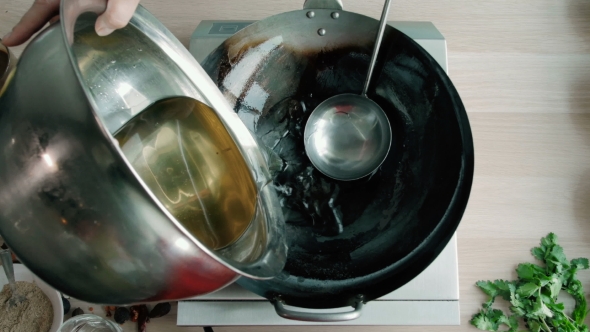 Chef Is Pouring Cooking Oil In Wok An Commercial Kitchen, Stock Footage
