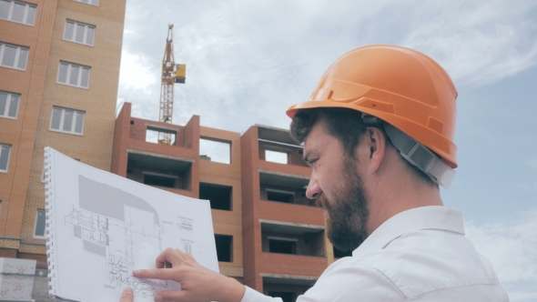 Architect Looking At Blueprints At a Building Site., Stock Footage