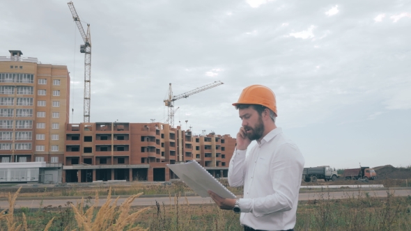 Architect Talking On Cell Phone On a Construction Site., Stock Footage
