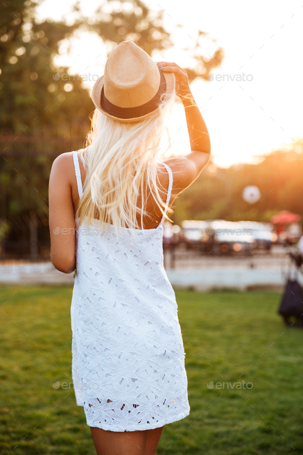 Back view of a woman wearing white dress and hat Stock Photo by ...