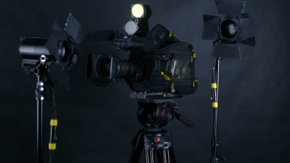 Camcorder, Video Camera And Professional Studio Lights In a ...