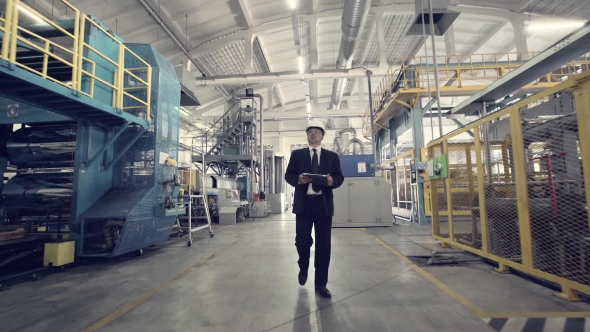 Businessman Walking Through Factory, Stock Footage | VideoHive