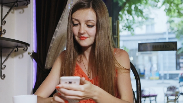 Attractive Girl In Red Talking On a Smartphone., Stock Footage | VideoHive